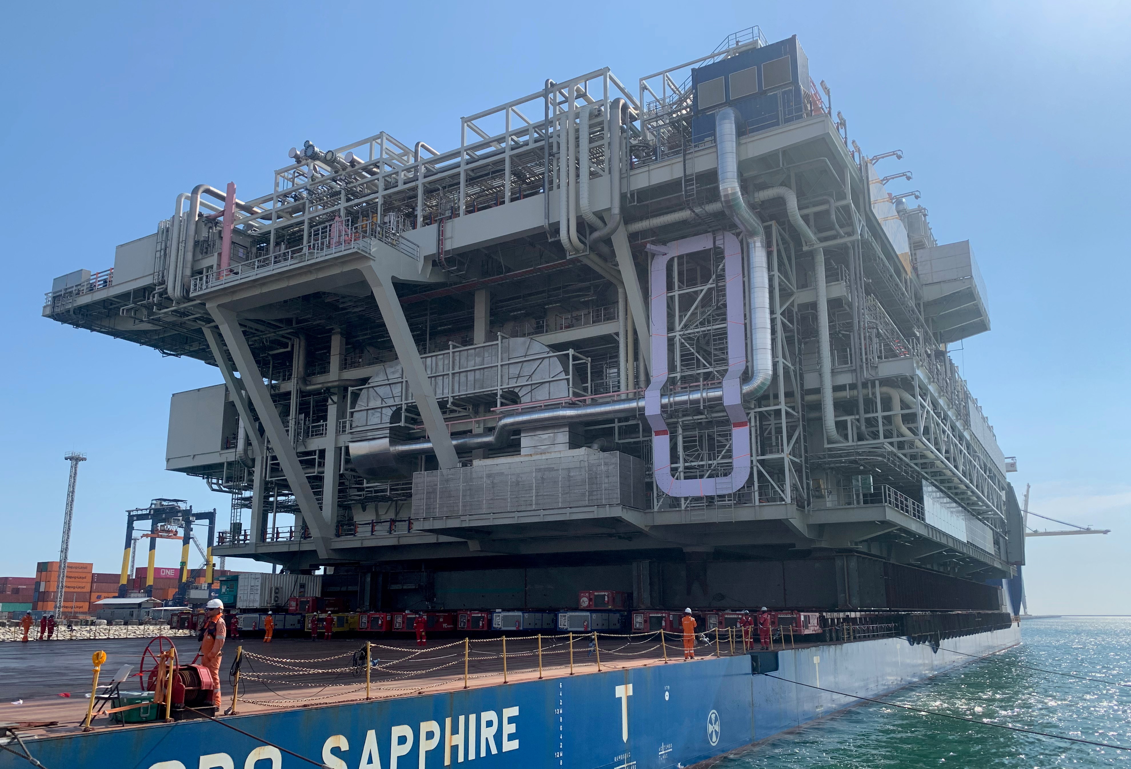 Mammoet loads-out mega main support frame module with 604 axle-lines of ...