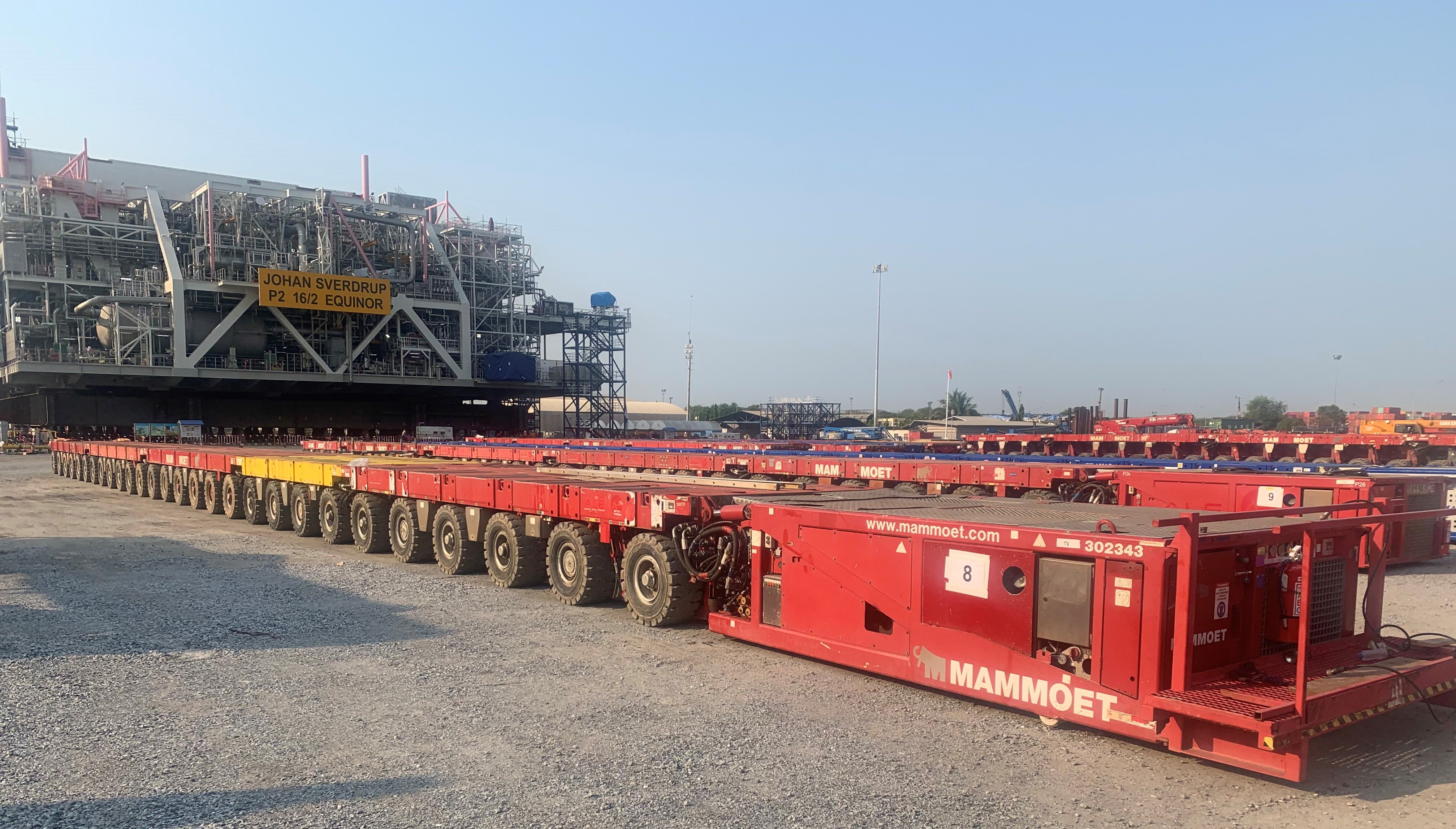 Mammoet loads-out mega main support frame module with 604 axle-lines of ...